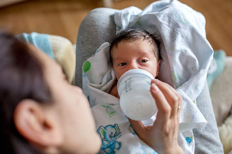 How Much Does A Newborn Eat? Feeding FAQs Answered